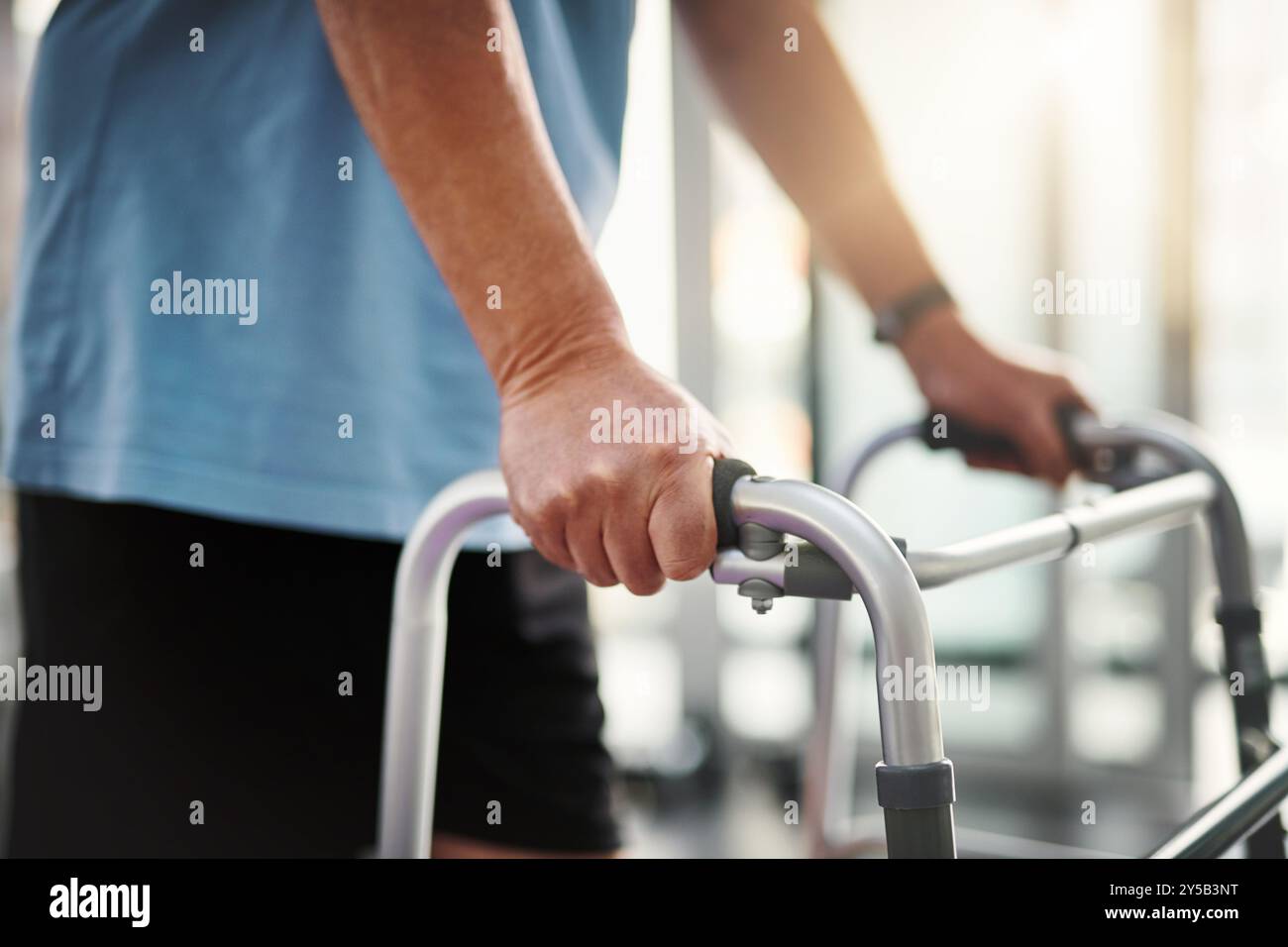 Health, physiotherapy and hands old man with walker for rehabilitation ...