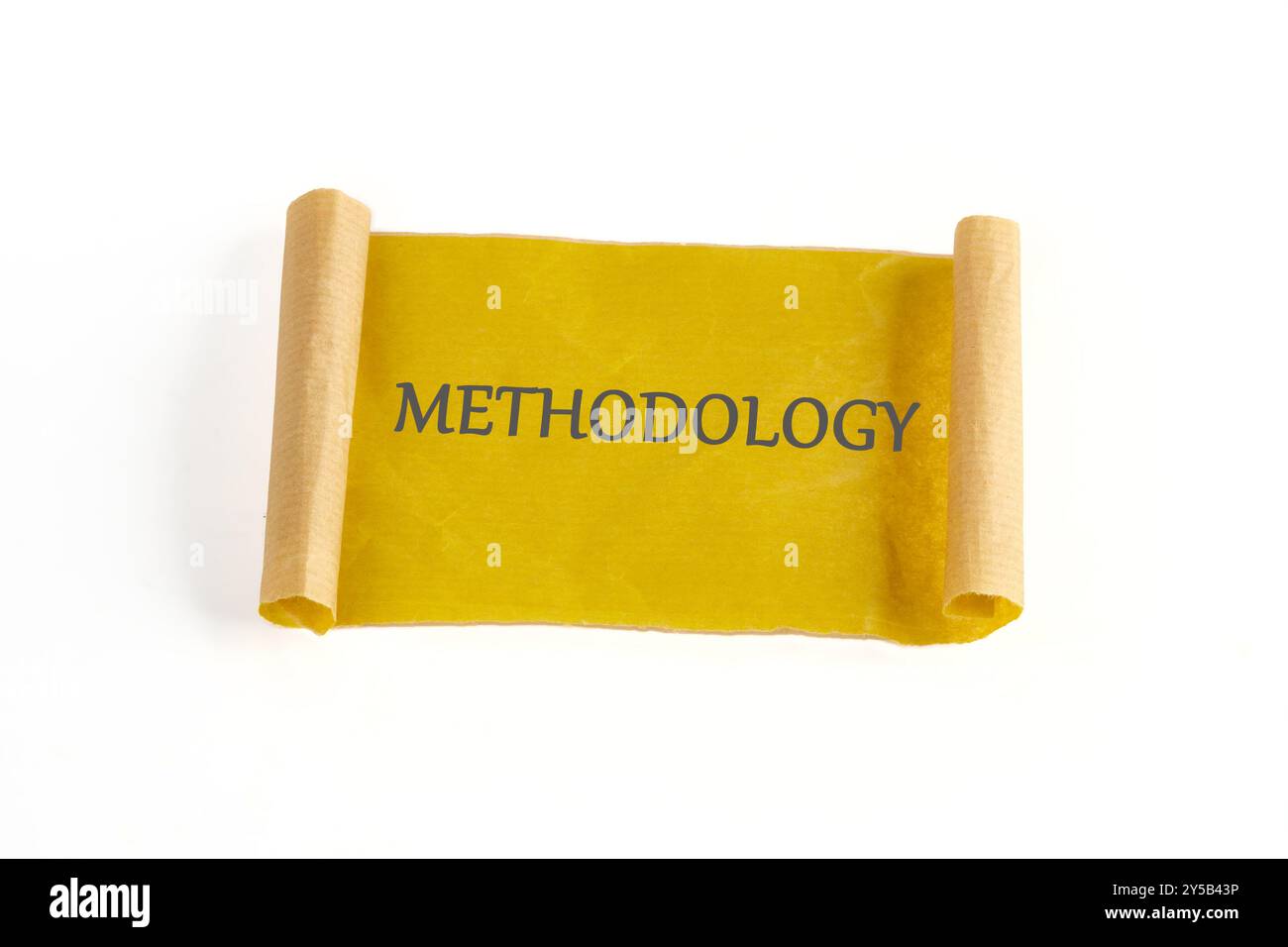 Technology concept. METHODOLOGY written on paper, a mustard-colored ...