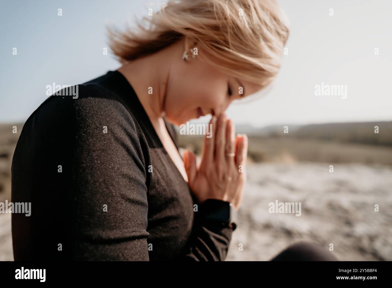 Woman Praying in Nature Stock Photo - Alamy