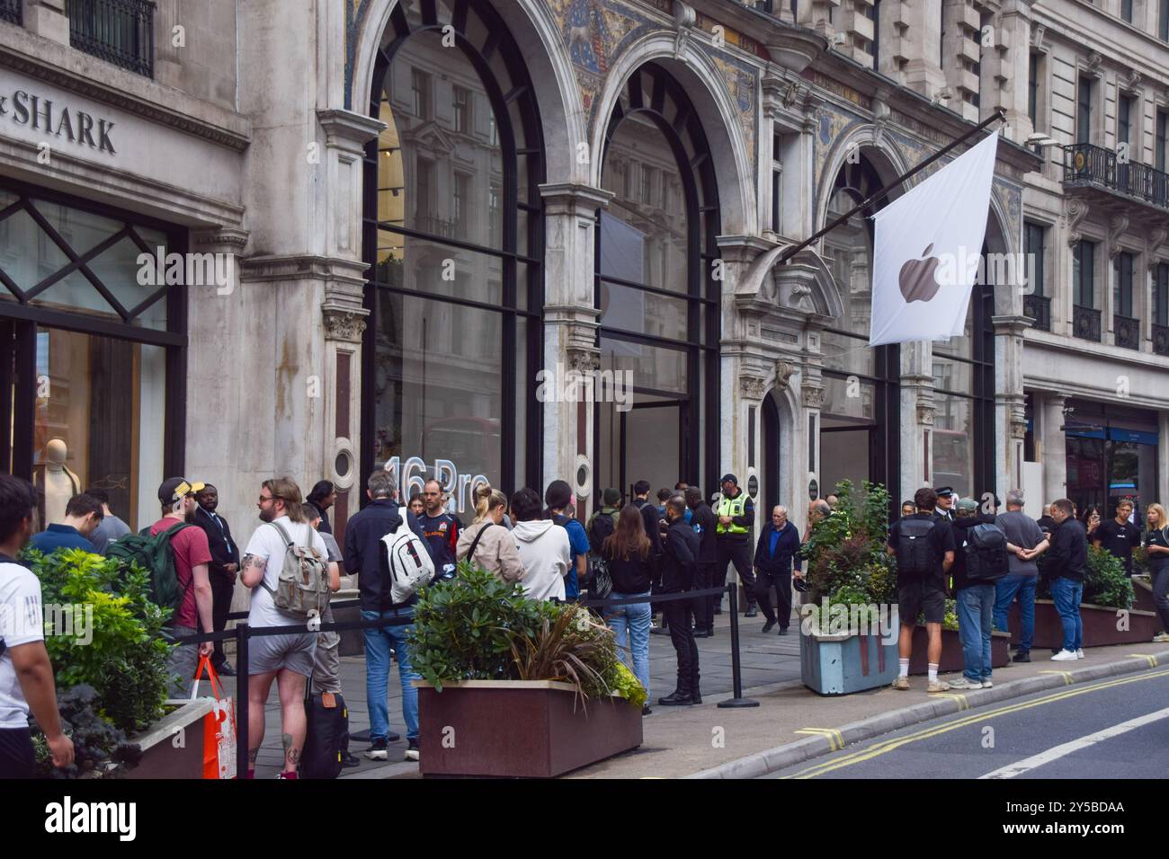 London, UK. 20th September 2024. Customers queue outside the Apple ...