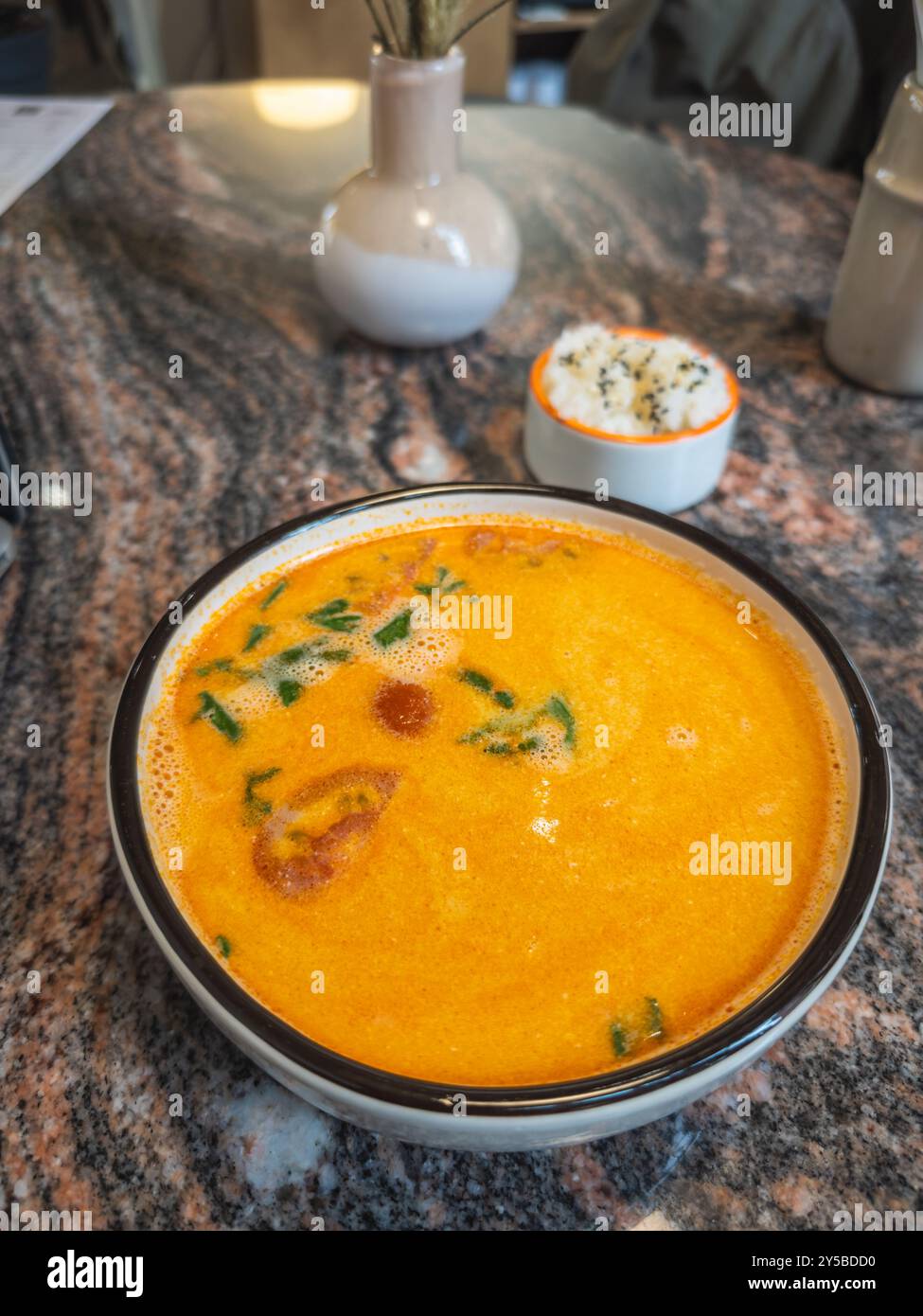 Spicy Tom-Yam Soup with Rice Stock Photo - Alamy