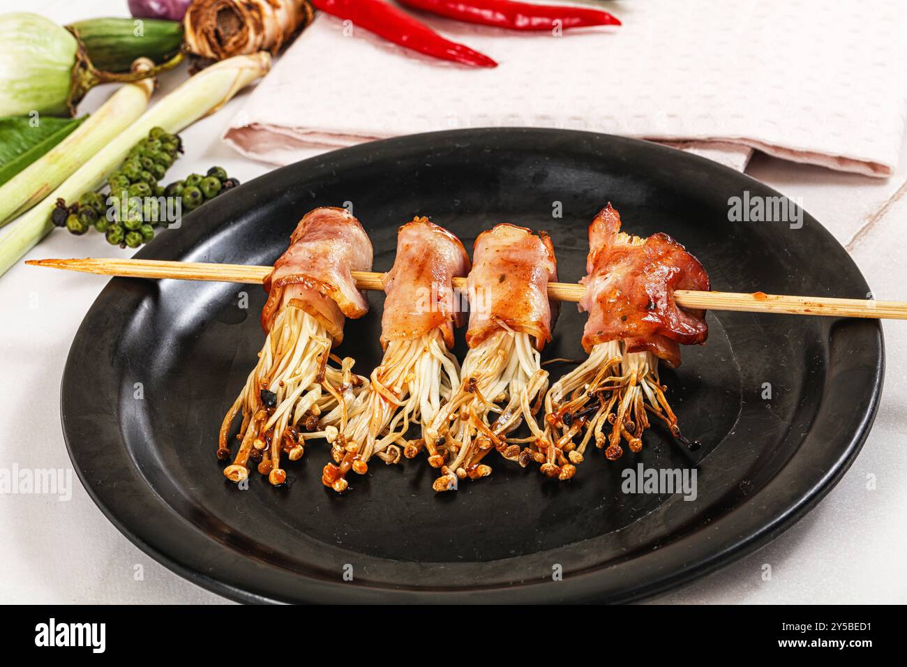 Thai Street foof satay with bacon and mushroom enoki skewer Stock Photo ...