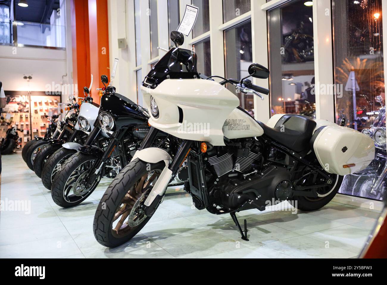 Harley-Davidson motorcycles for sale parked inside the showroom of the ...