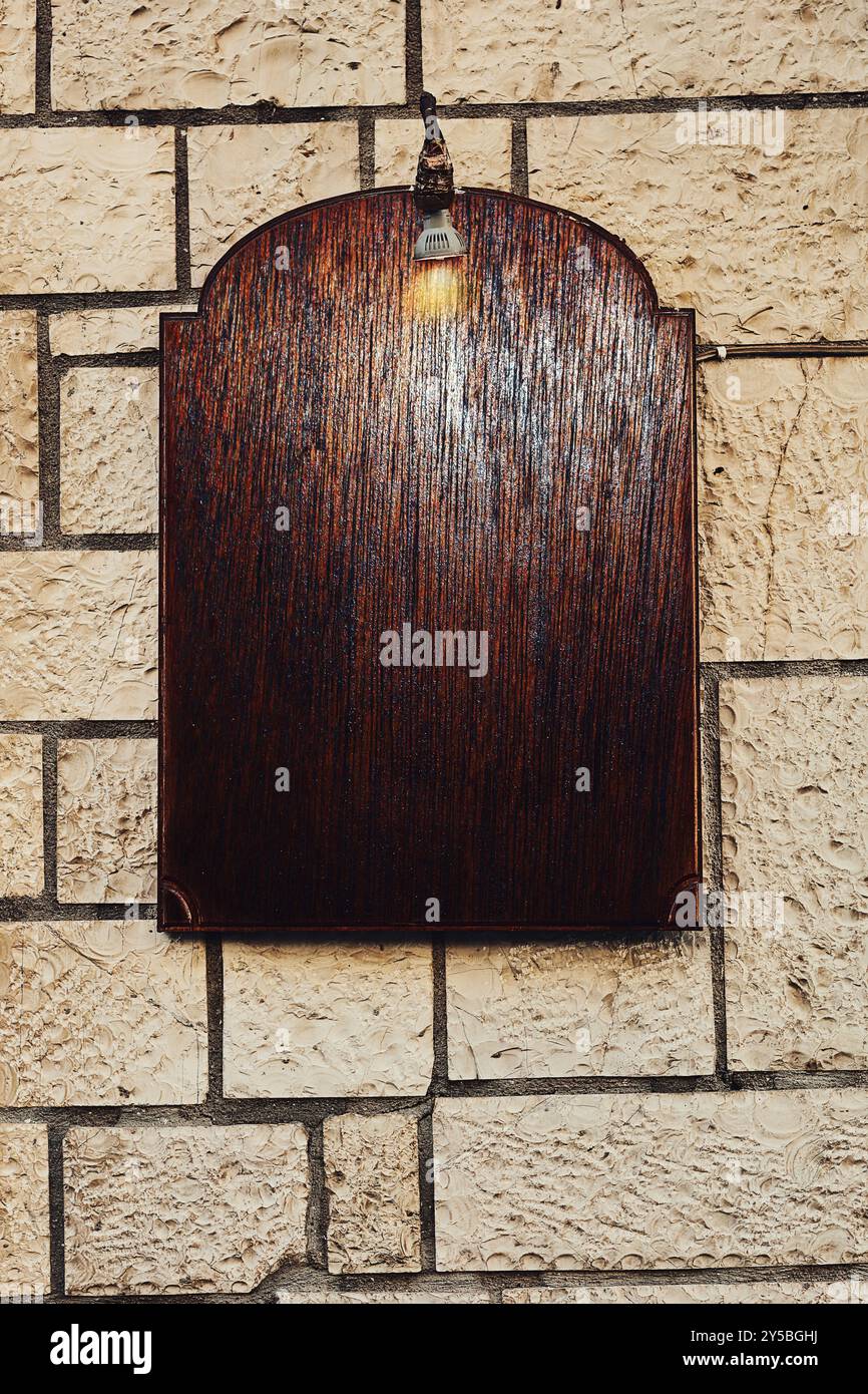 Wood, vintage and sign board on brick wall with light as text placement ...