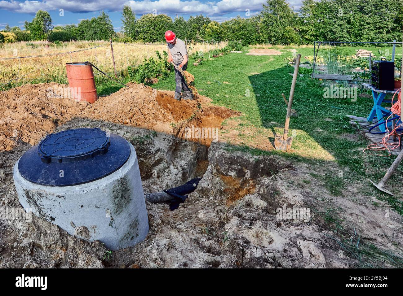 An absorption trench with perforated drainage pipe wrapped in ...