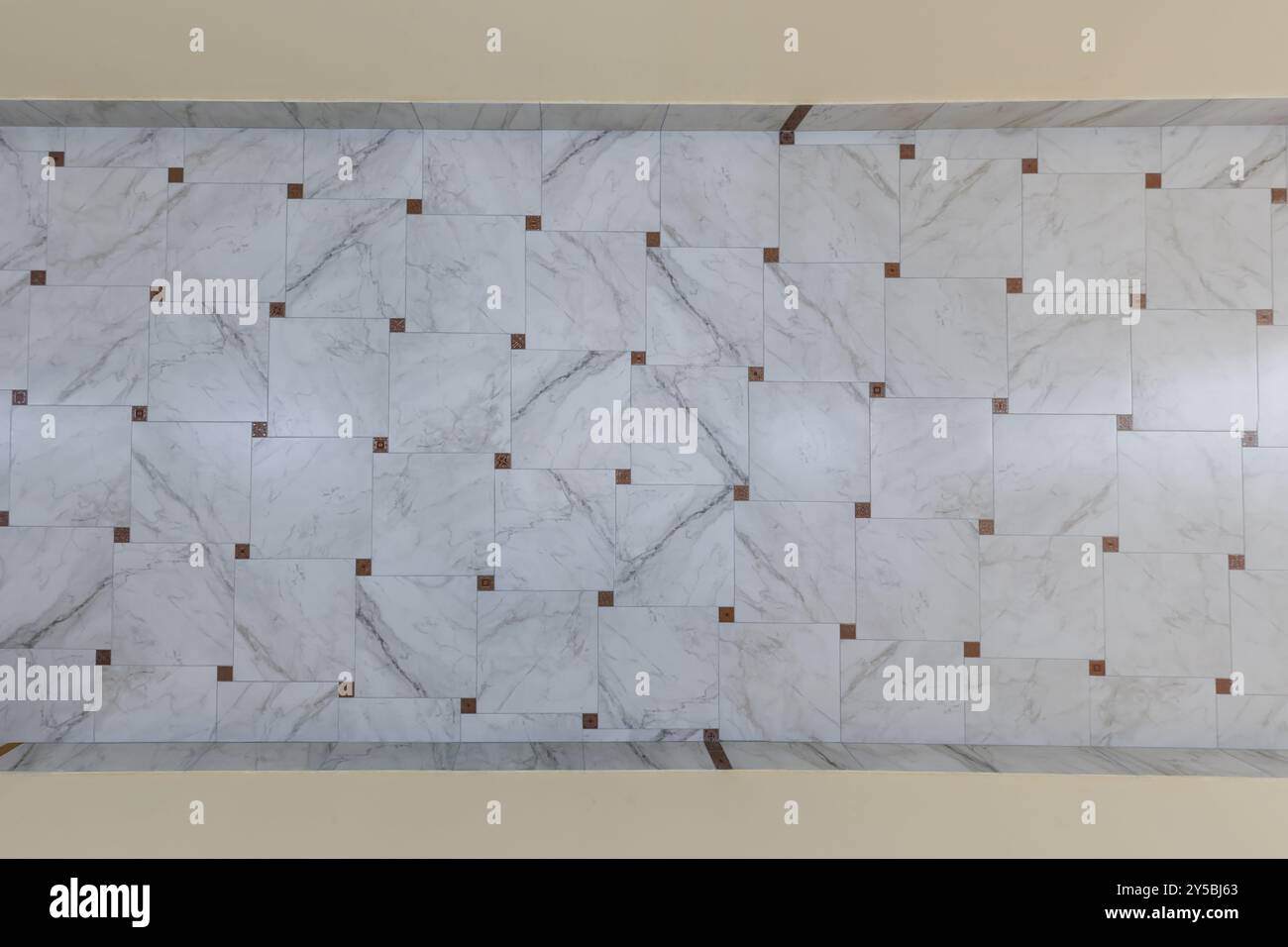stone and ceramic floor tiles texture in corridor, view from above ...