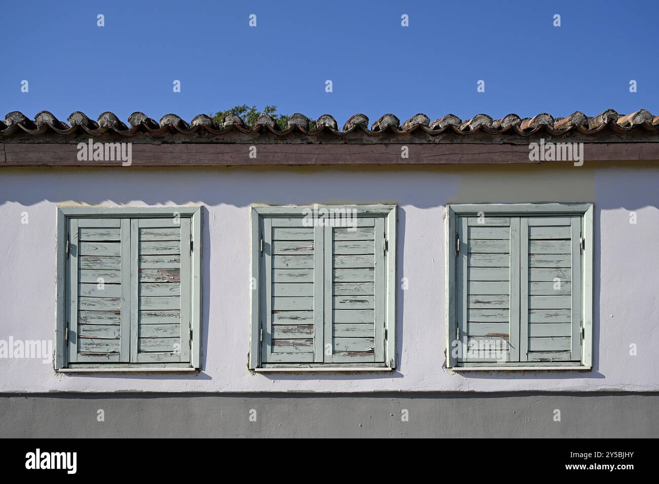 Three windows in an old house Stock Photo - Alamy