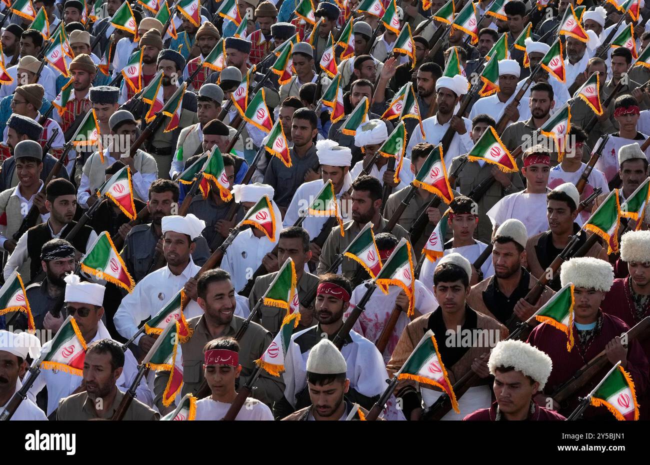 Members of the Iranian paramilitary Basij force, wearing their ...