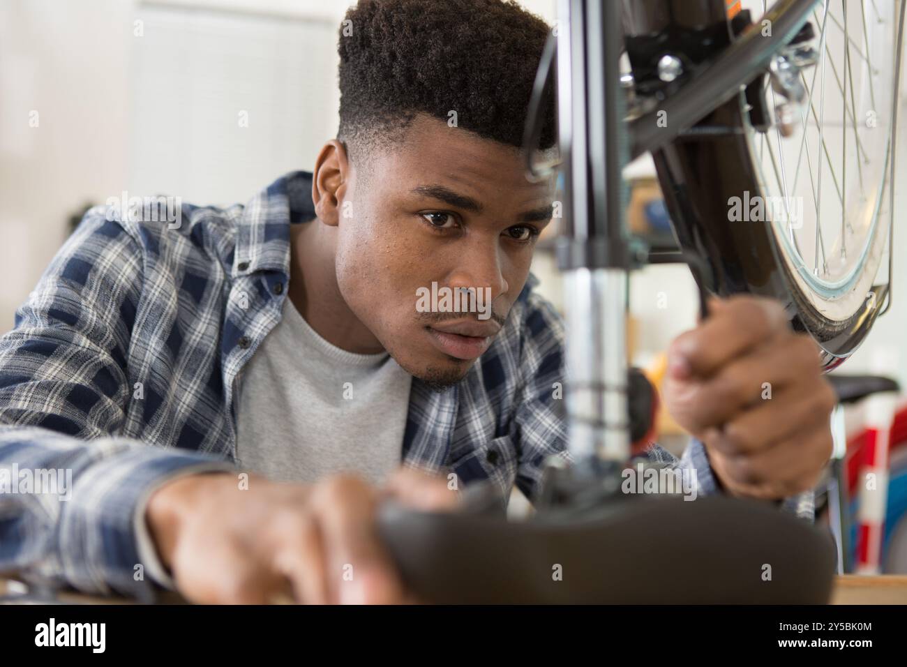 man fixing a bike Stock Photo - Alamy