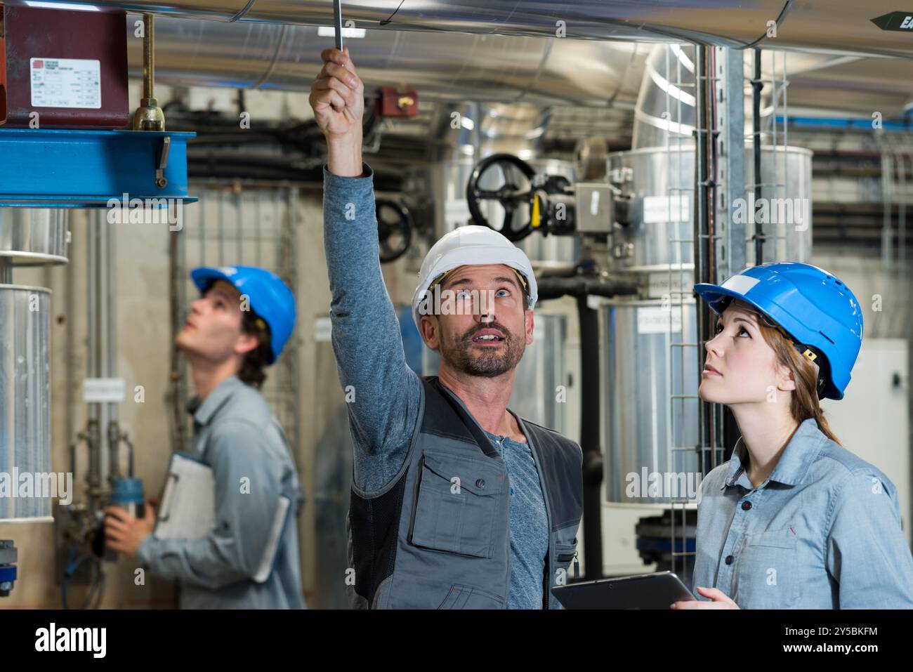 industrial maintenance team inspecting leaks Stock Photo - Alamy