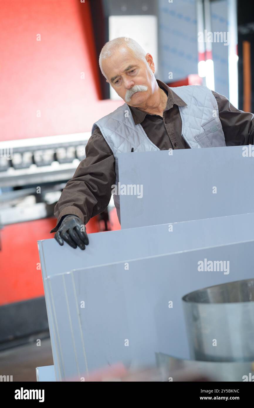 industrial worker sorting the product Stock Photo - Alamy