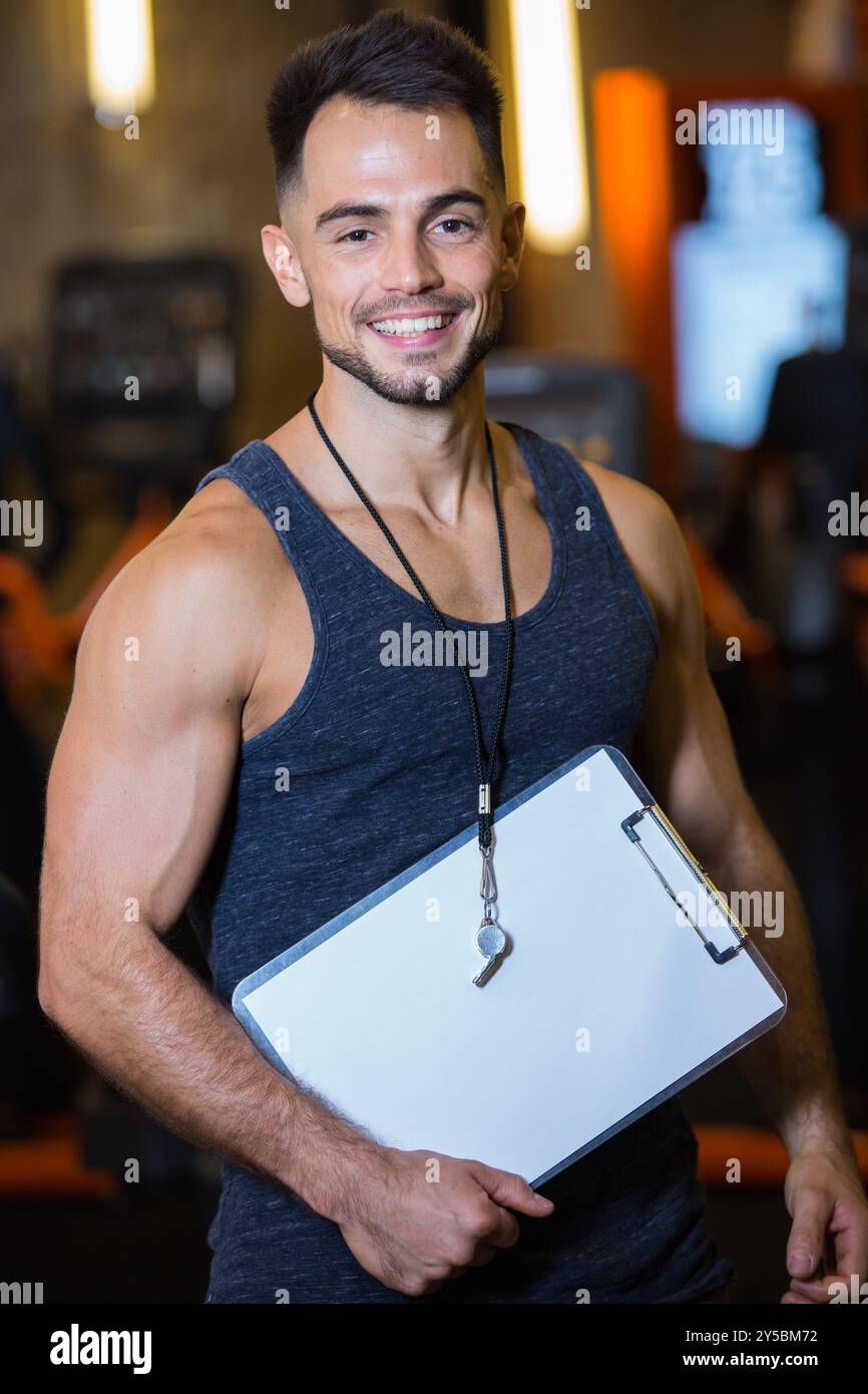 workout plan on clipboard in the gym Stock Photo - Alamy