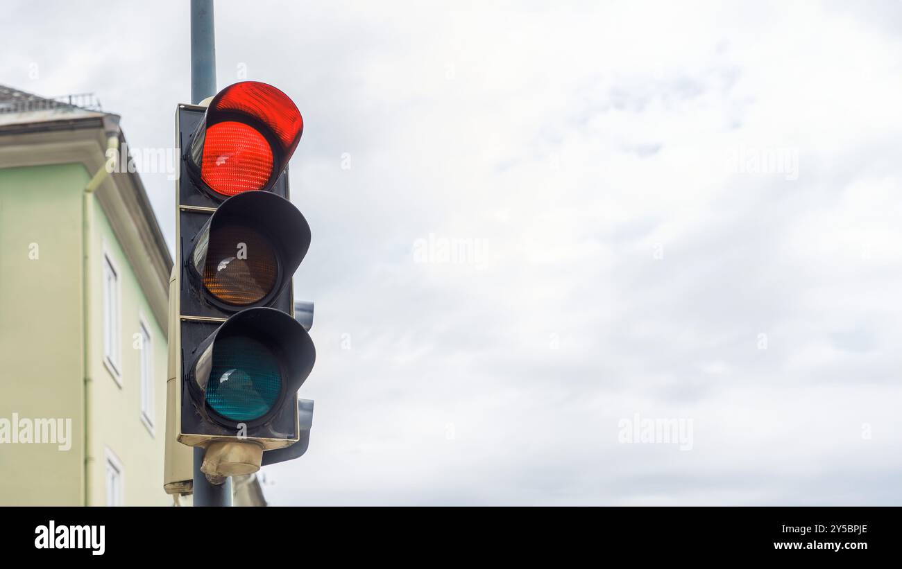 Traffic light with red, yellow, green signals at intersection under ...