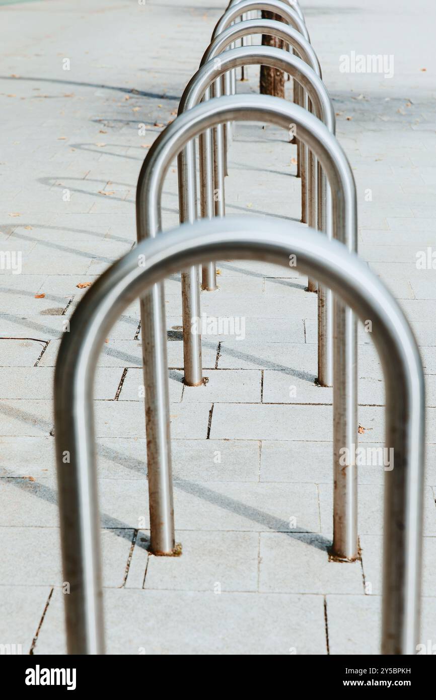 Urban bike parking with modern metal stands, city street bicycle racks ...