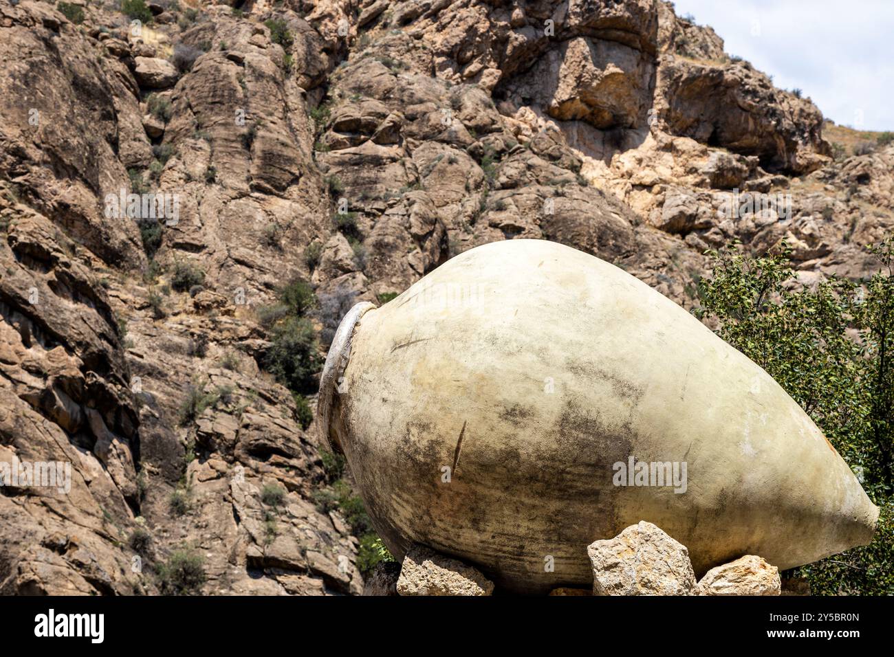 old kvevri wine vessel and cliff in background in Areni village in ...