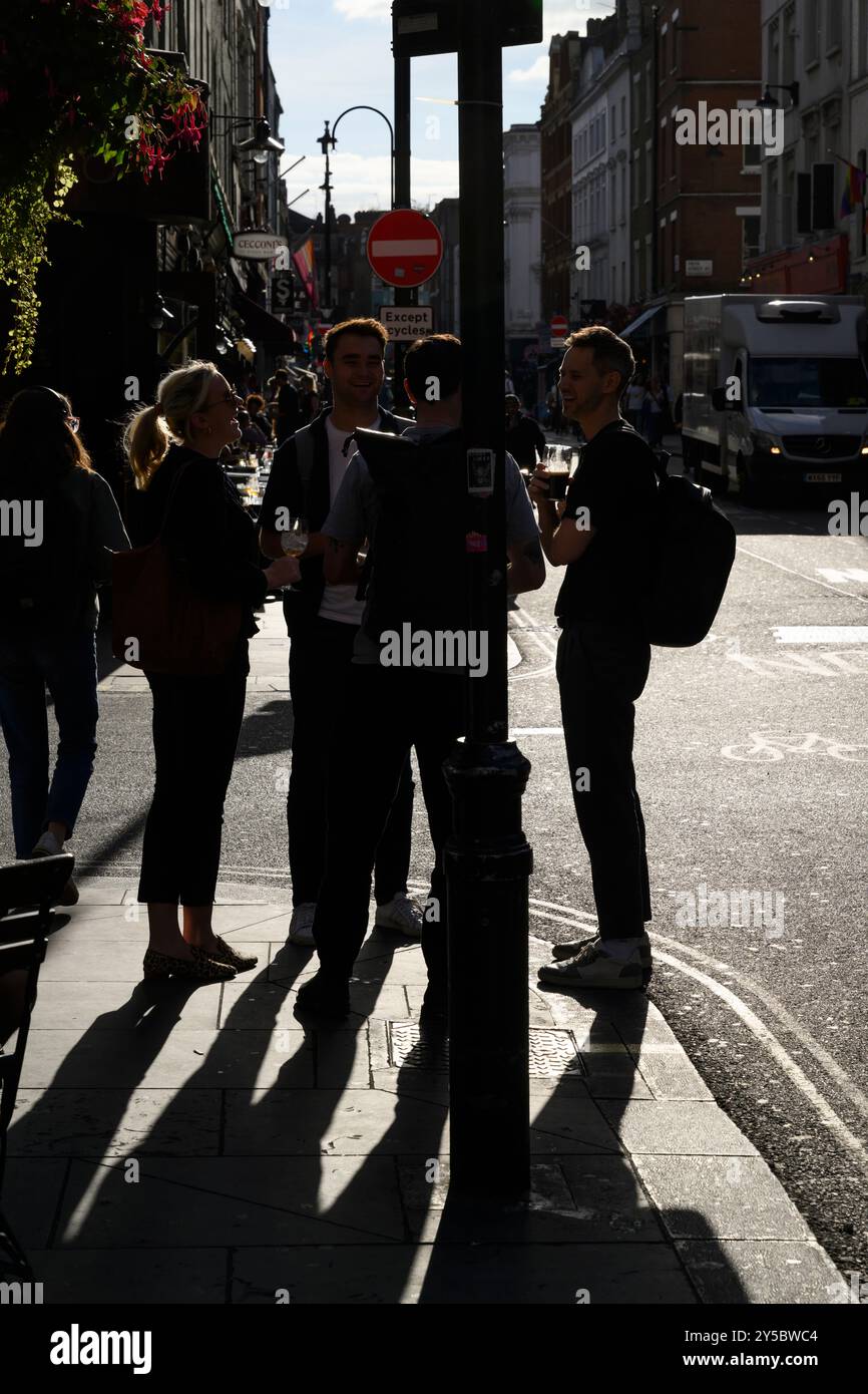 People drinking outside The Three Greyhounds Pub, Greek Street, Soho ...
