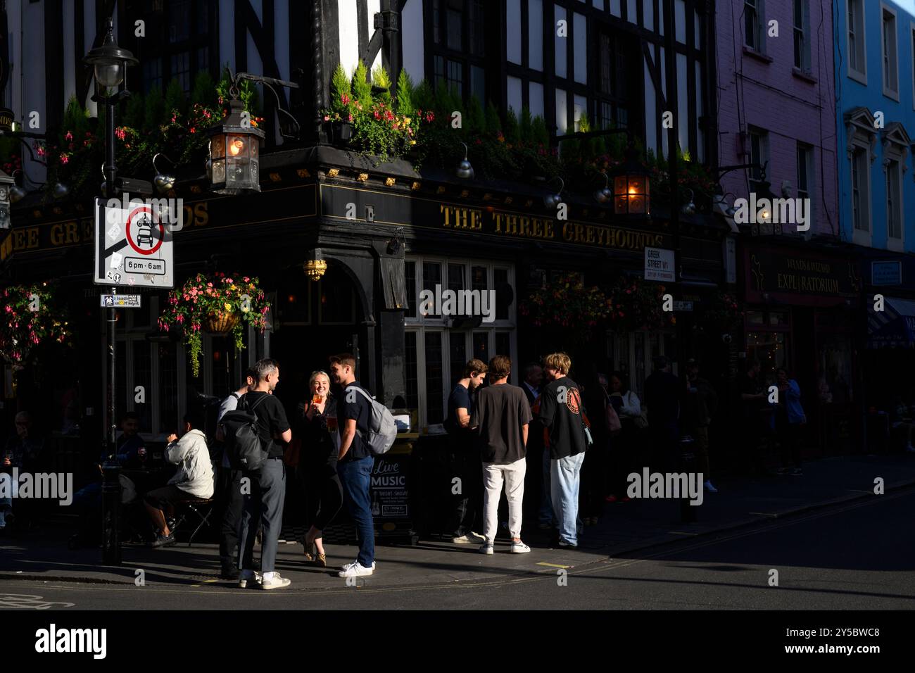 People drinking outside The Three Greyhounds Pub, Greek Street, Soho ...