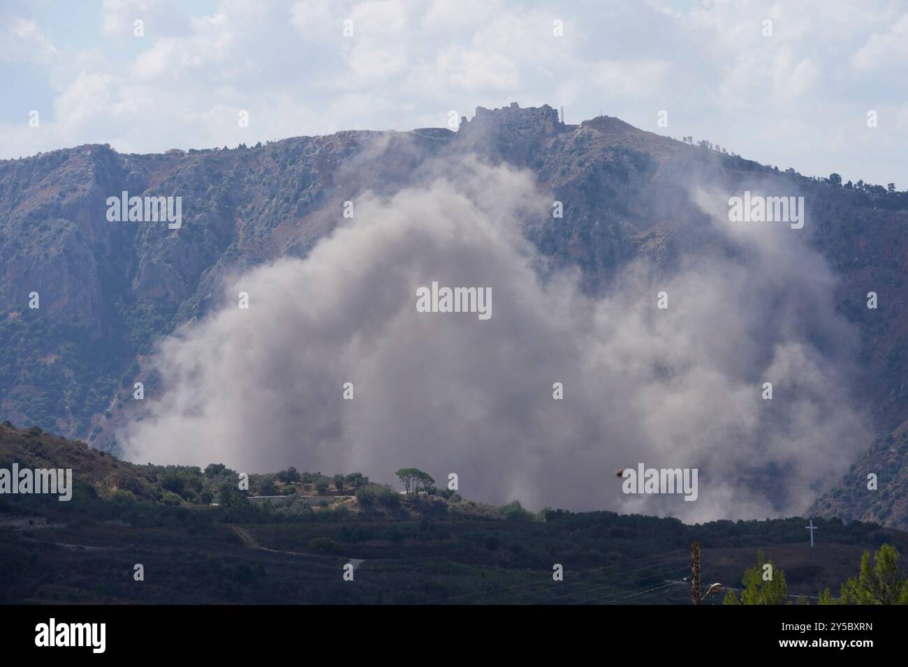 Smoke rises from Israeli shelling, seen from the southern Lebanese town ...