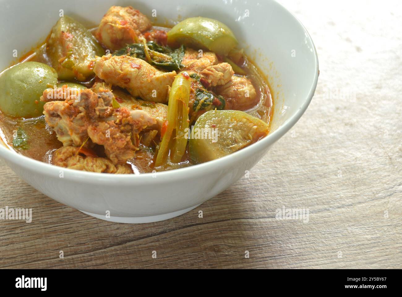spicy boiled chicken with mixed vegetable in jungle curry soup Thai ...