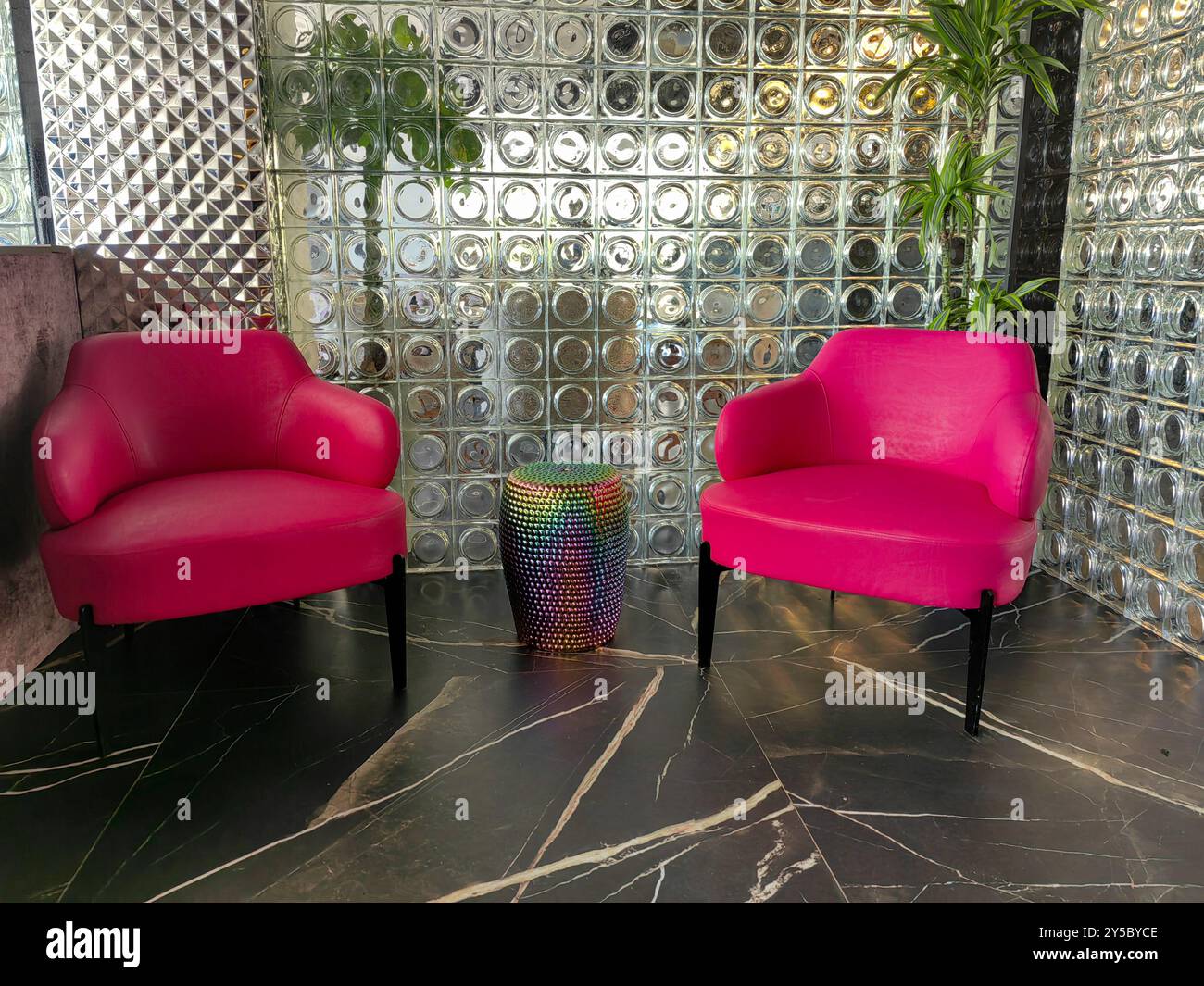 Two Red Pink Chairs in Comfort Zone with Glass Window Wall Decoration and Modern Disco-Colored ...