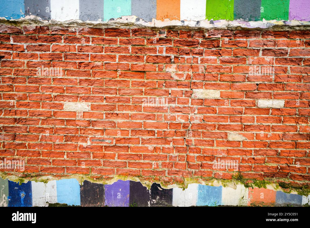 Old brick wall with colorful elements Stock Photo - Alamy