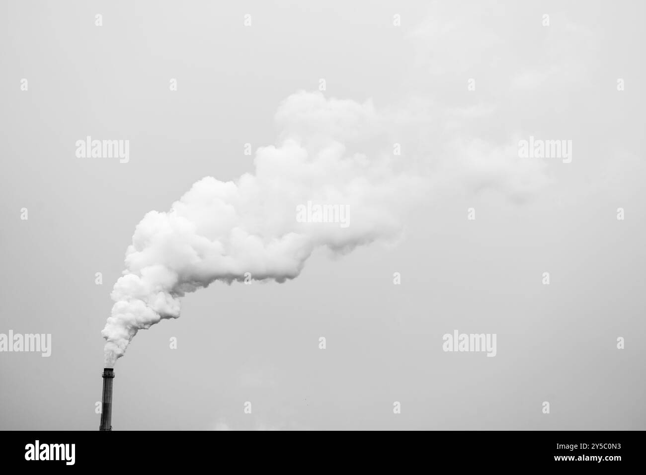 Cloud of smoke from a factory. Smoking chimney in the industrial area ...