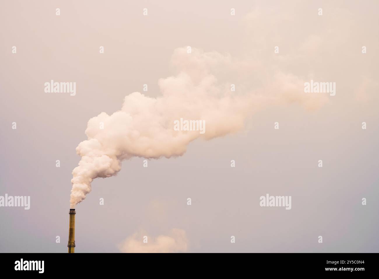 Cloud of smoke from a factory. Smoking chimney in the industrial area ...