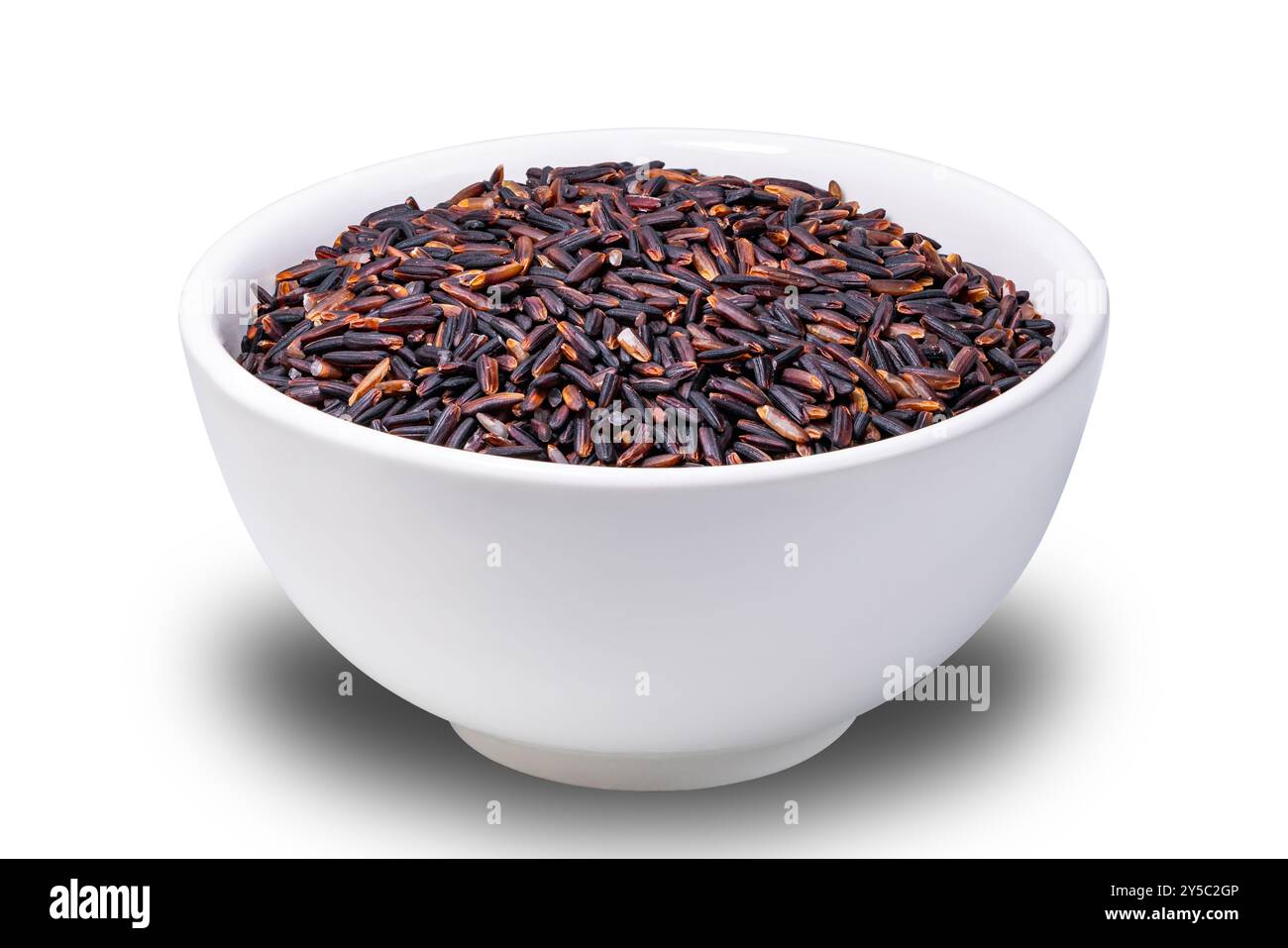 Closeup view of raw riceberry, rice berry seeds in white ceramic bowl ...
