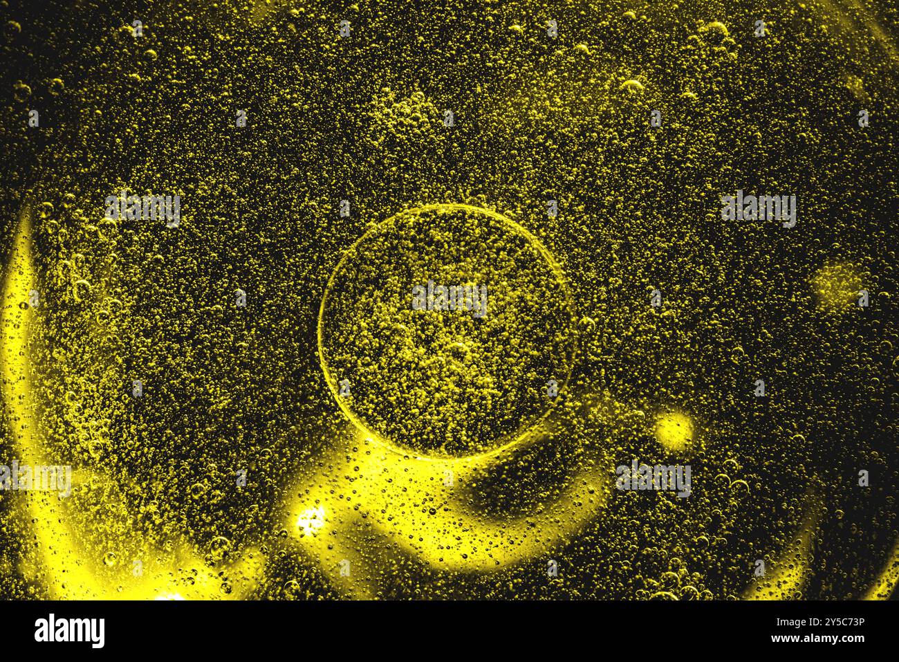 Oil drops in a glass of water Stock Photo - Alamy