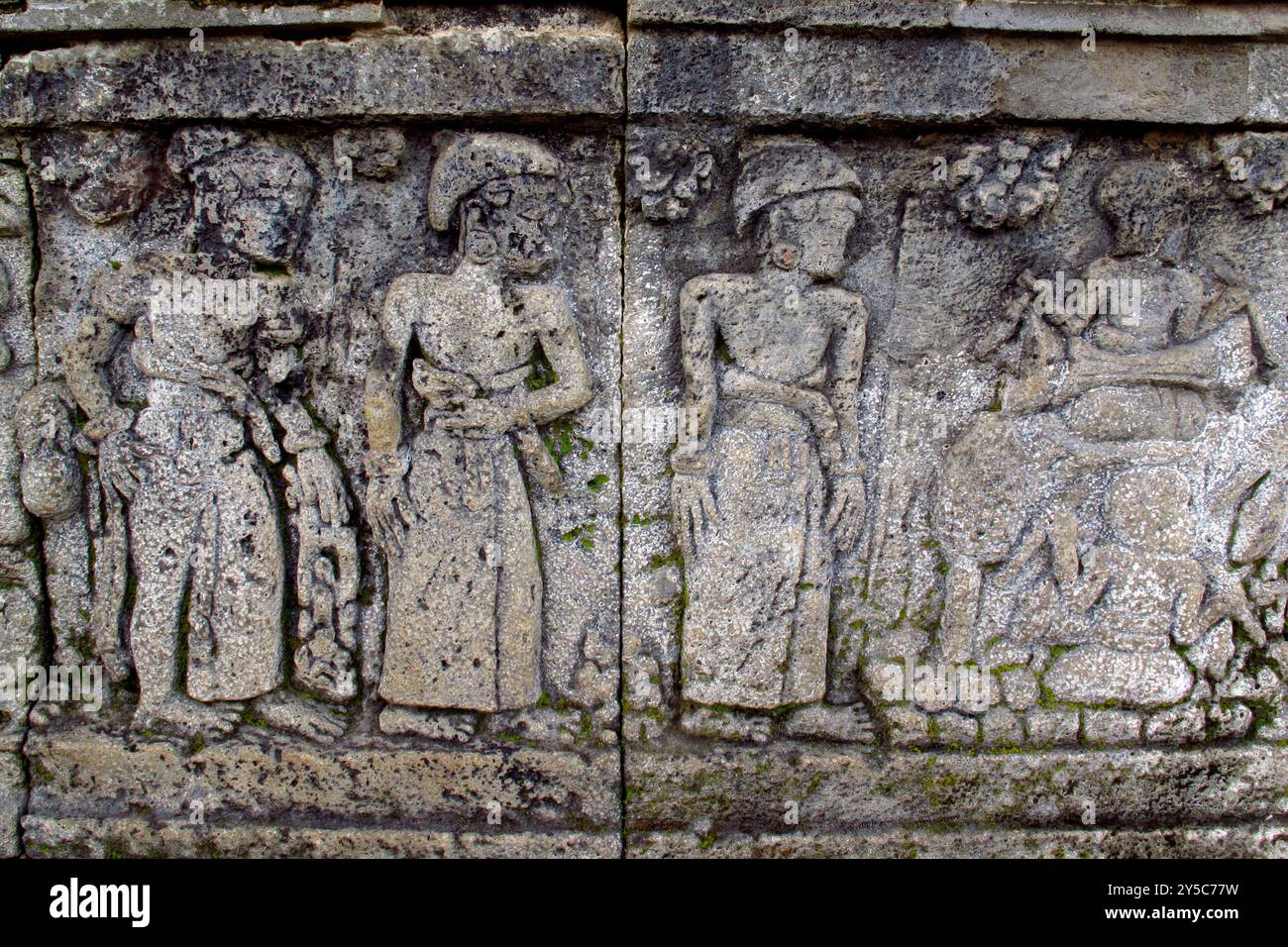 relief or carving on the stone wall at Penataran temple Stock Photo - Alamy