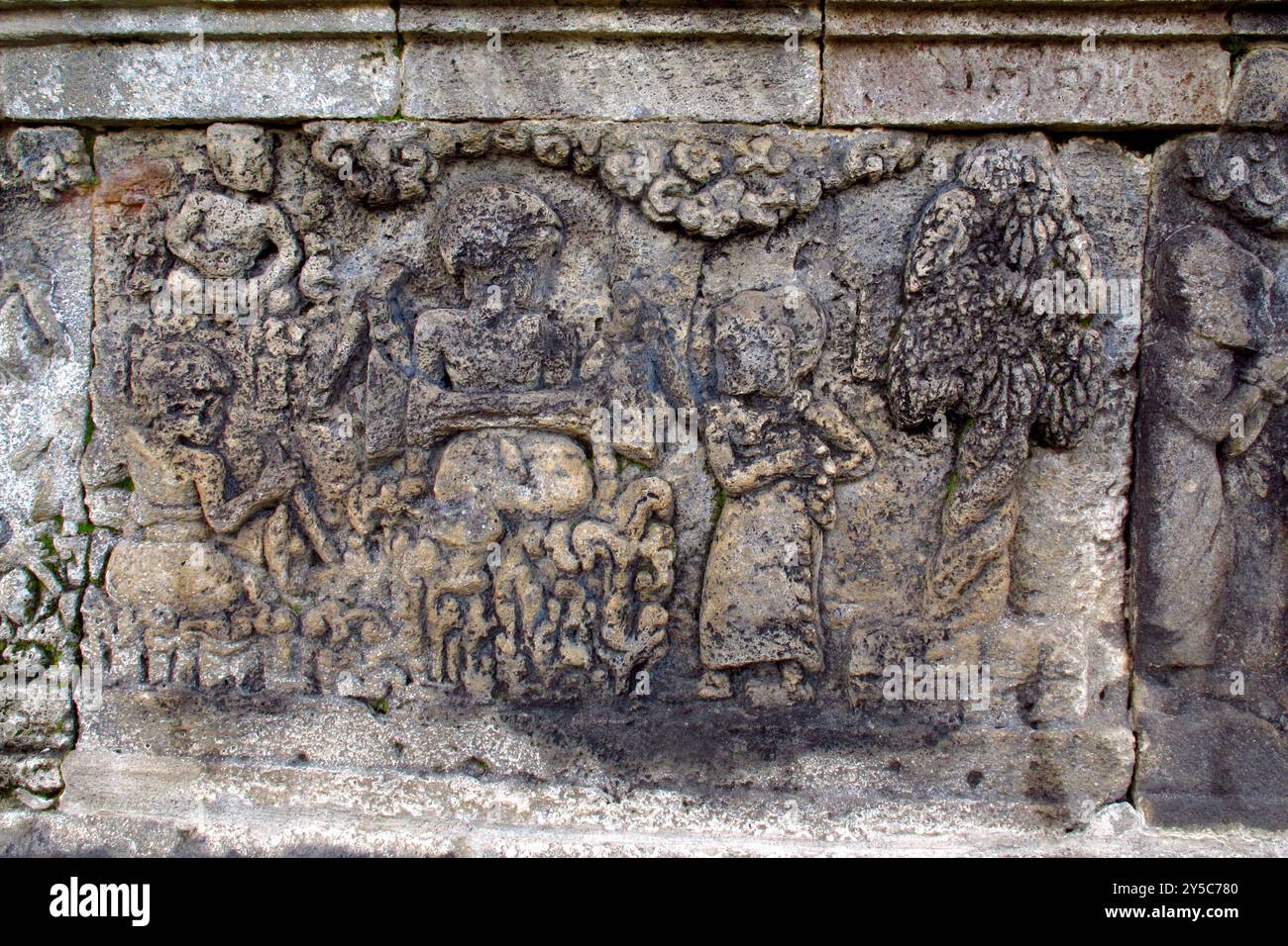 relief or carving on the stone wall at Penataran temple Stock Photo - Alamy