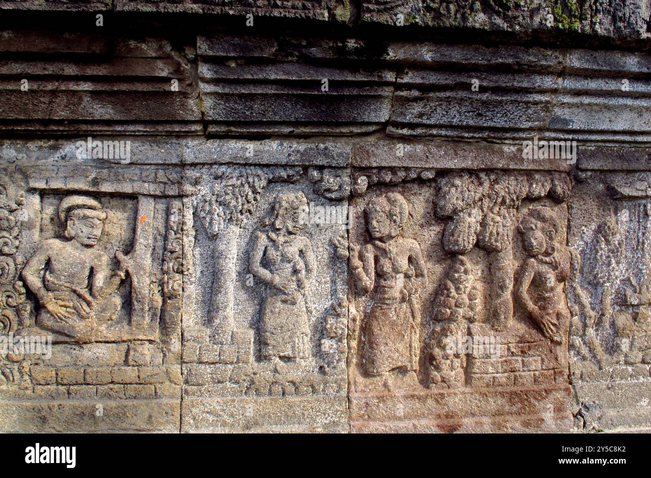 relief or carving on the stone wall at Penataran temple Stock Photo - Alamy