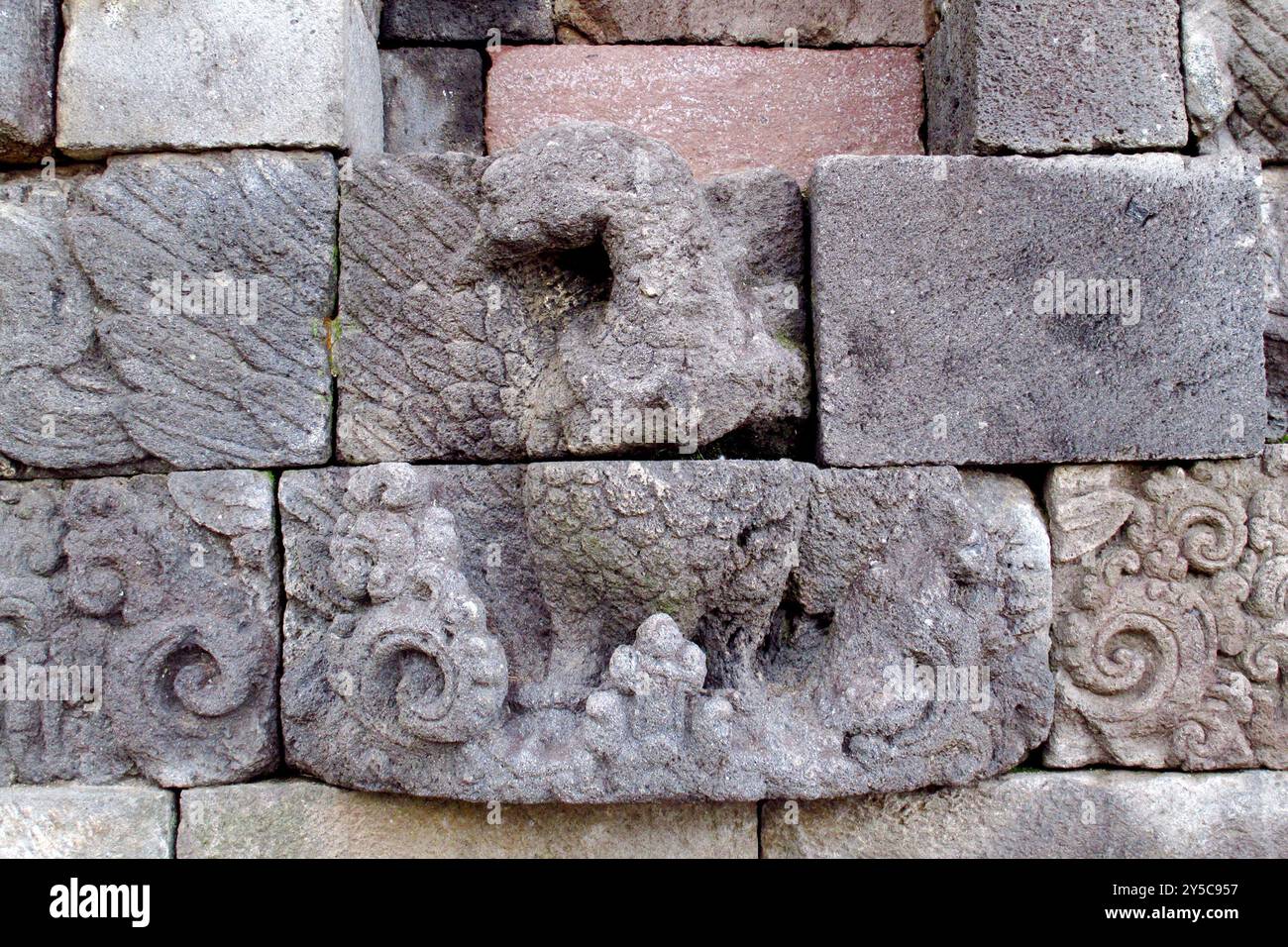 relief or carving on the stone wall at Penataran temple Stock Photo - Alamy