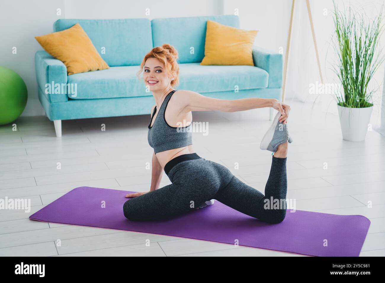 Photo of attractive charming strong athletic woman training stretching ...