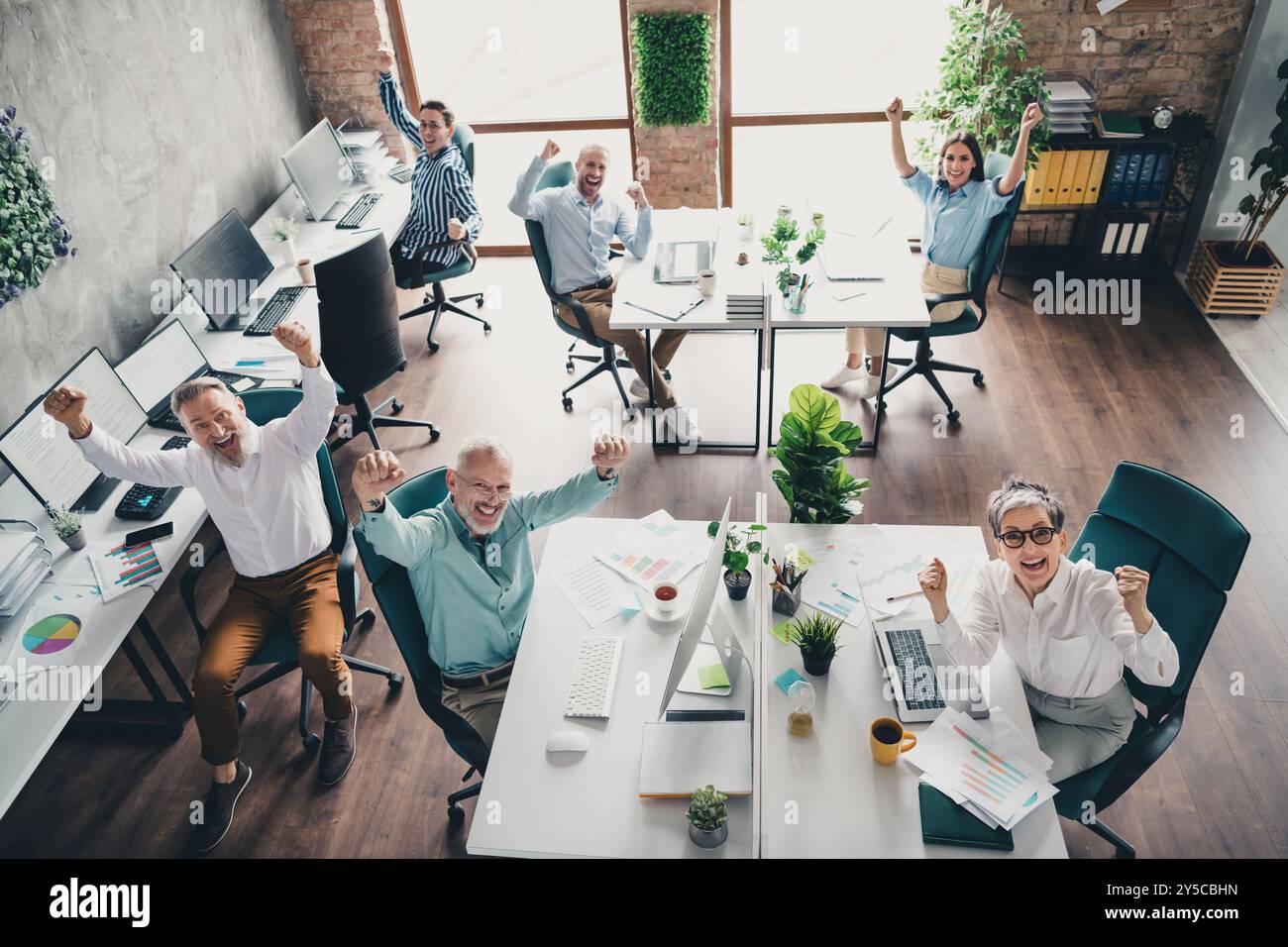 Full body top view photo of teamwork people work together winning ...