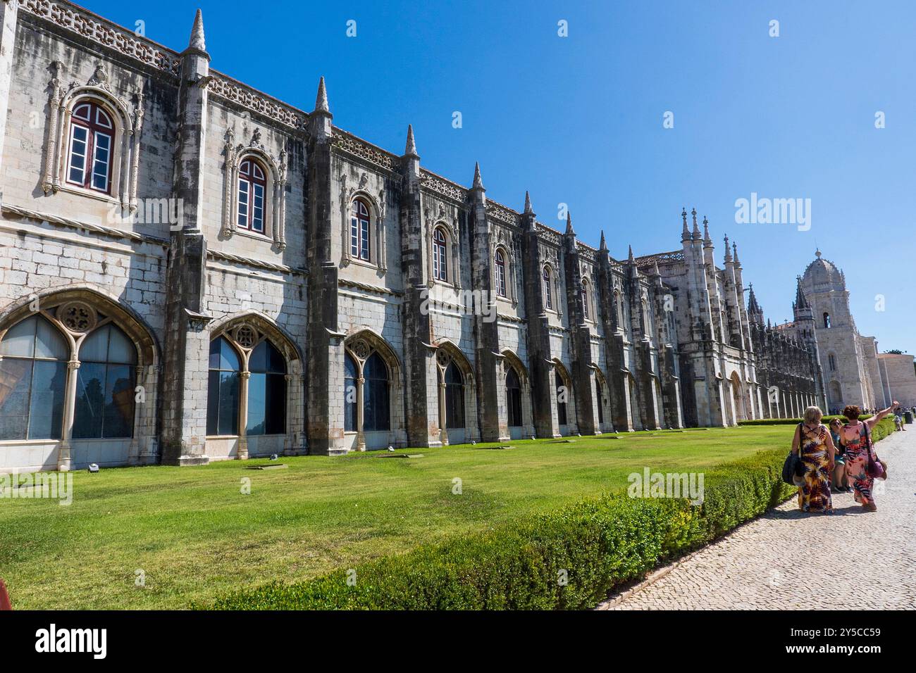 Tourists visit The Jerónimos Monastery ,an example of the late ...