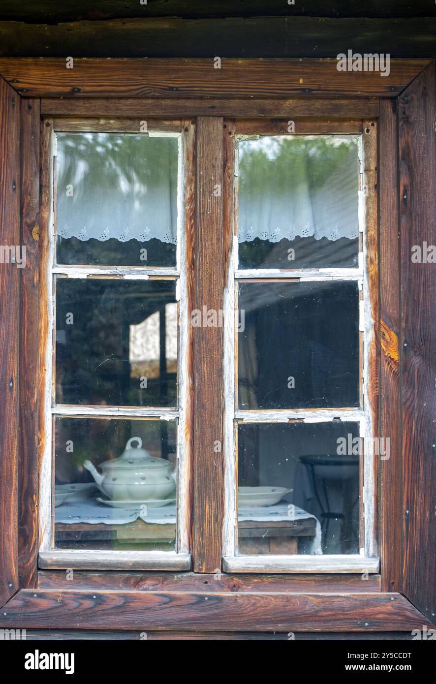 Window of a wooden house with a view of an porcelain set Stock Photo ...