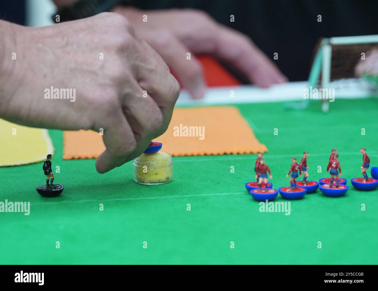 A Subbuteo figure is cleaned before a match, during the Subbuteo World ...