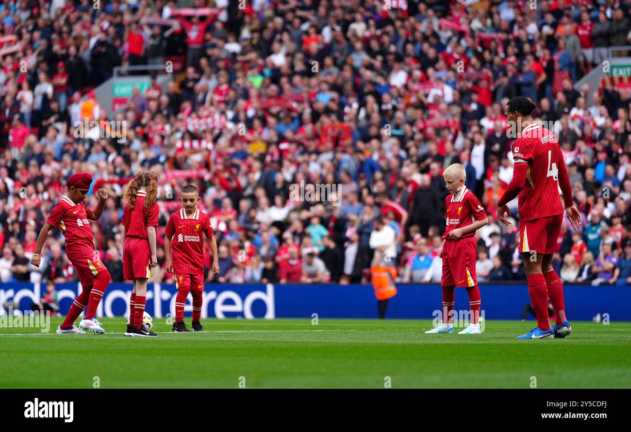 Liverpool's Virgil van Dijk with the match day mascots during the ...