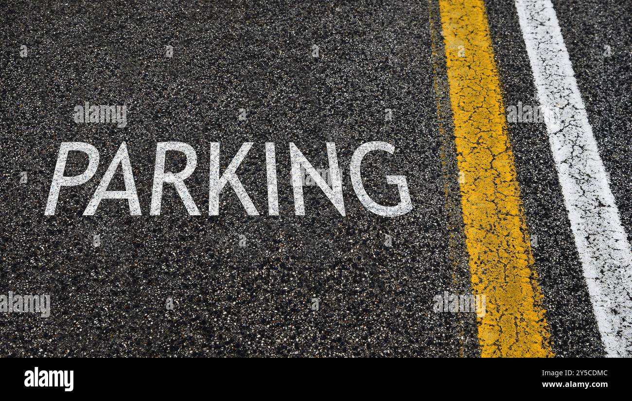 Parking lot. Word Parking written on asphalt Stock Photo - Alamy