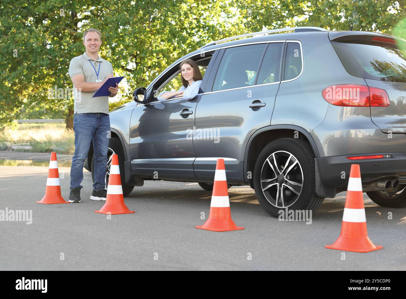 Woman passing maneuverability driving test on track Stock Photo - Alamy