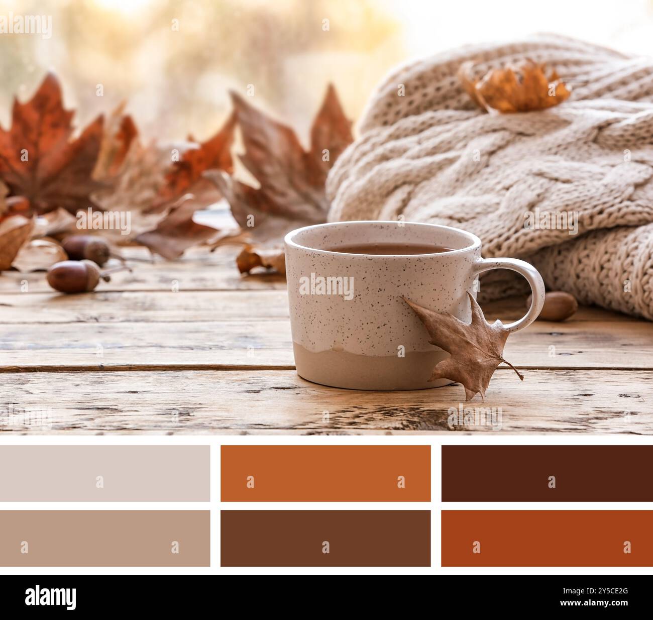 Shades of fall. Picture of cup and autumn leaves on wooden sill and ...