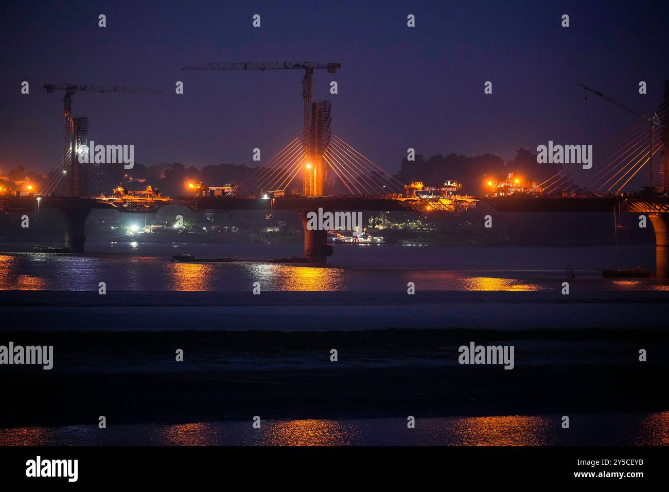 A view of workers constructing a bridge over the river Brahmaputra in ...