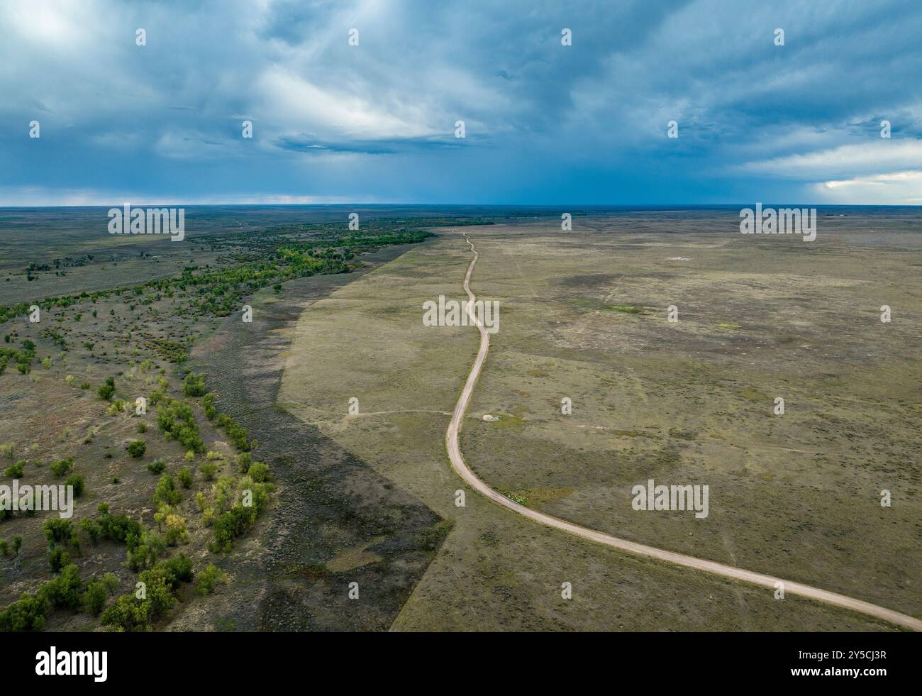 A road cuts through the Cimarron National Grassland in western Kansas ...