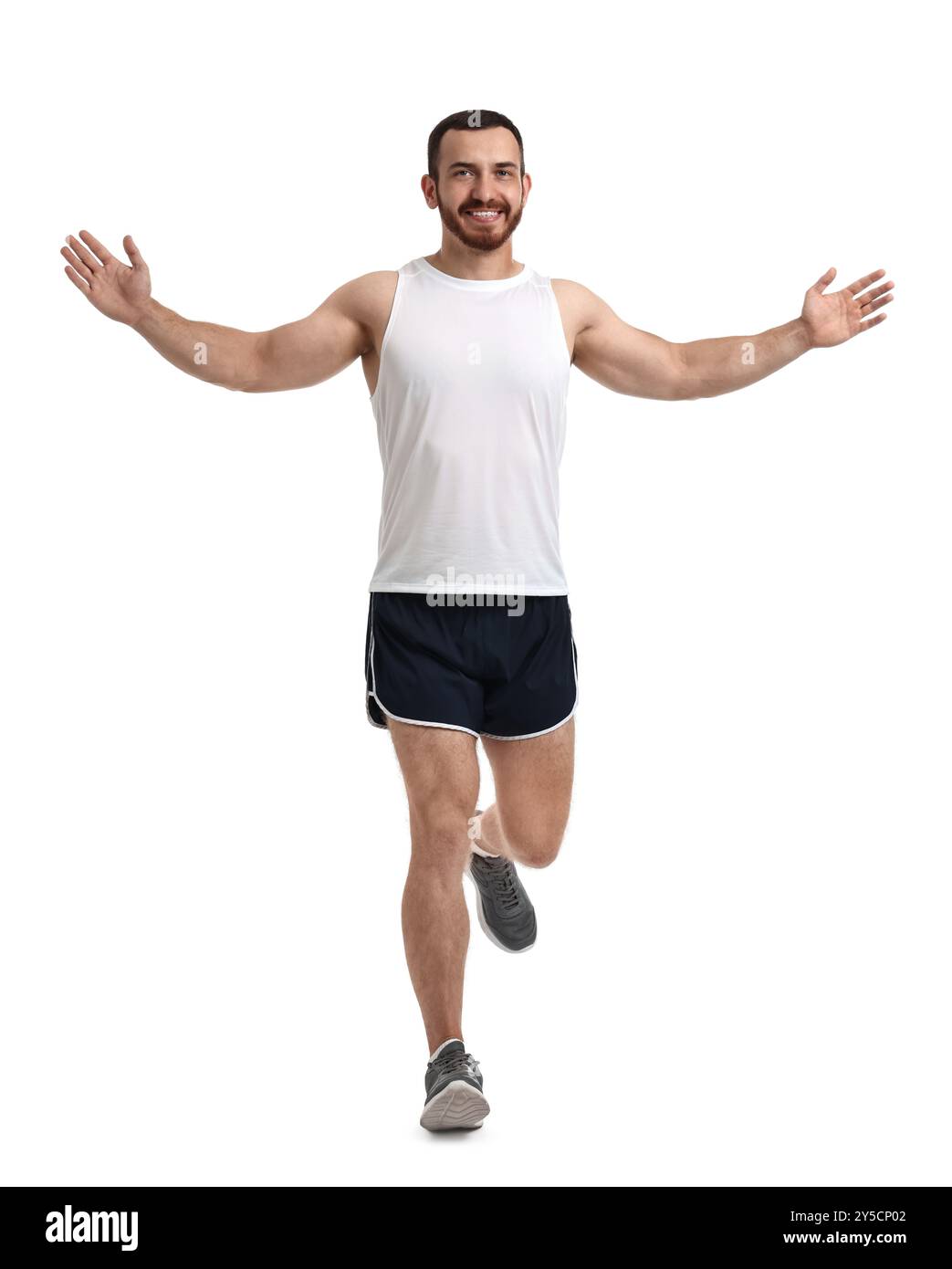 Handsome young man running on white background Stock Photo - Alamy