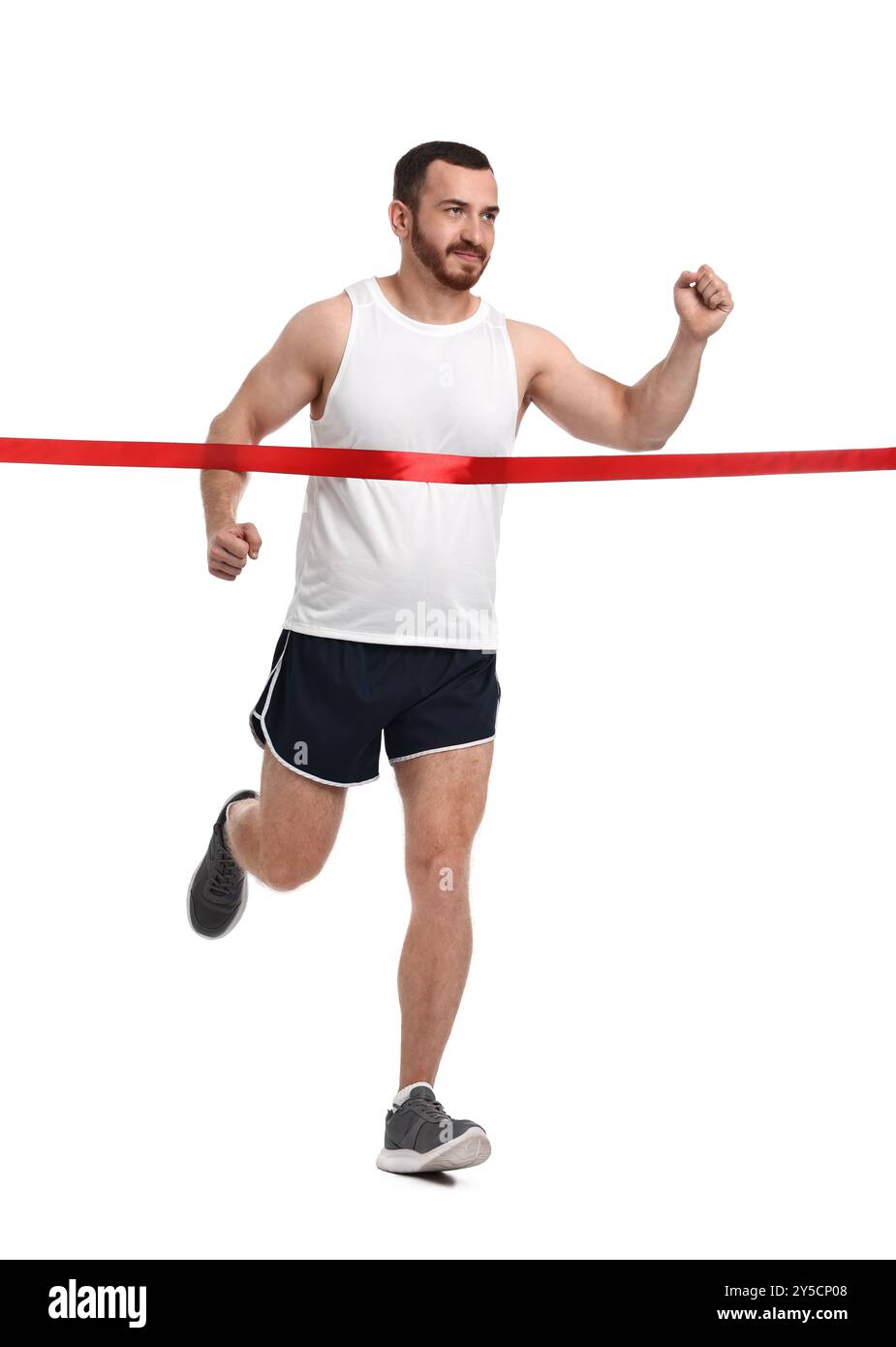 Handsome young man crossing red finish line on white background Stock ...