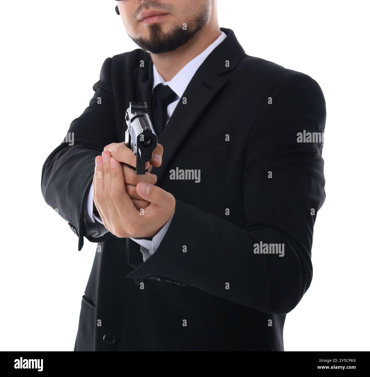 Young bodyguard in suit using gun on white background, closeup Stock ...
