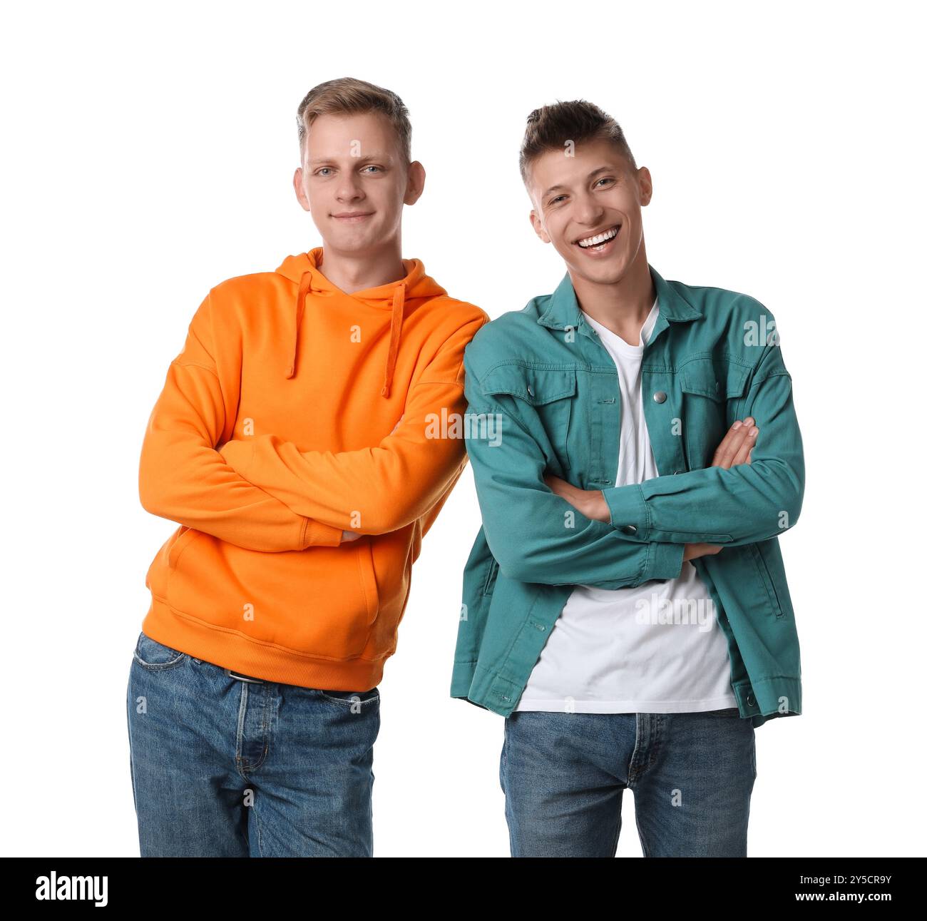 Two happy brothers posing with crossed arms on white background Stock ...
