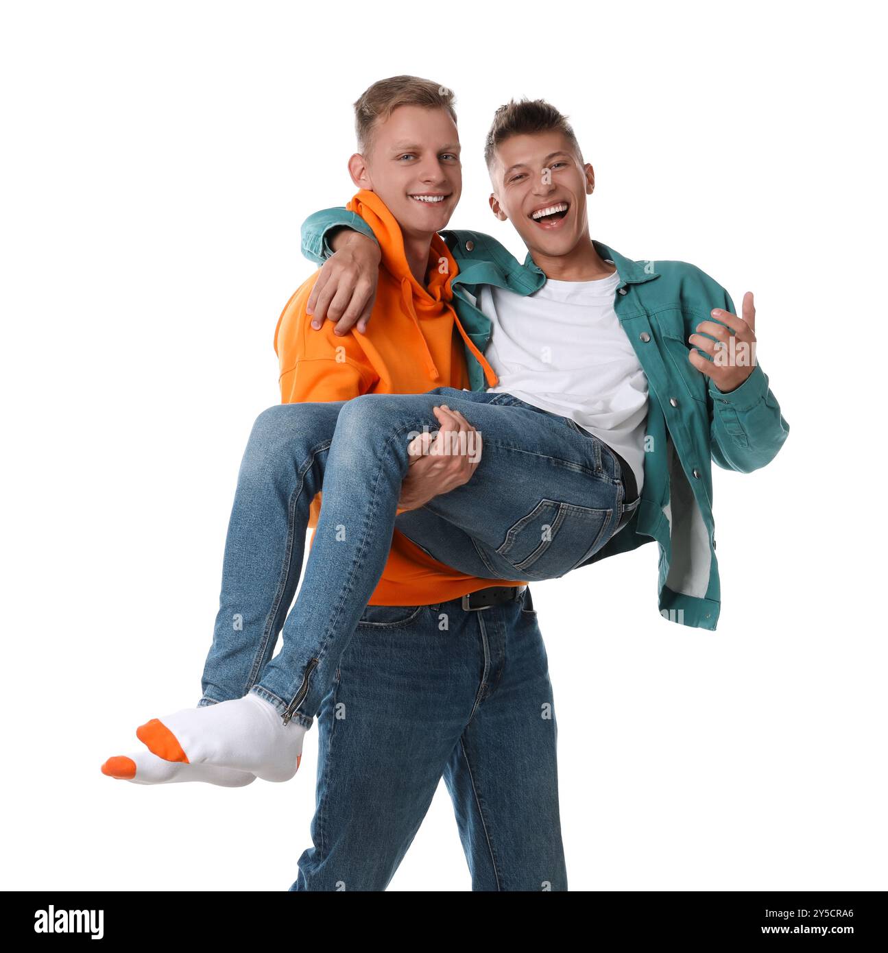 Two happy brothers having fun on white background Stock Photo - Alamy