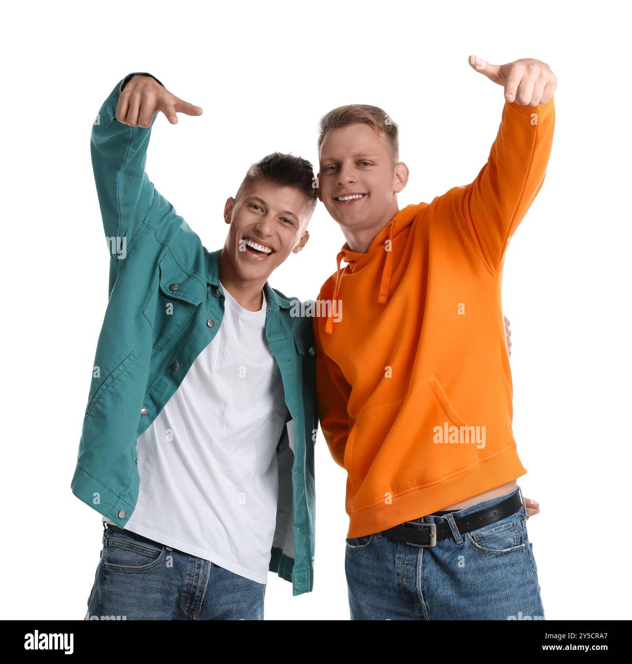 Two young brothers having fun on white background Stock Photo - Alamy